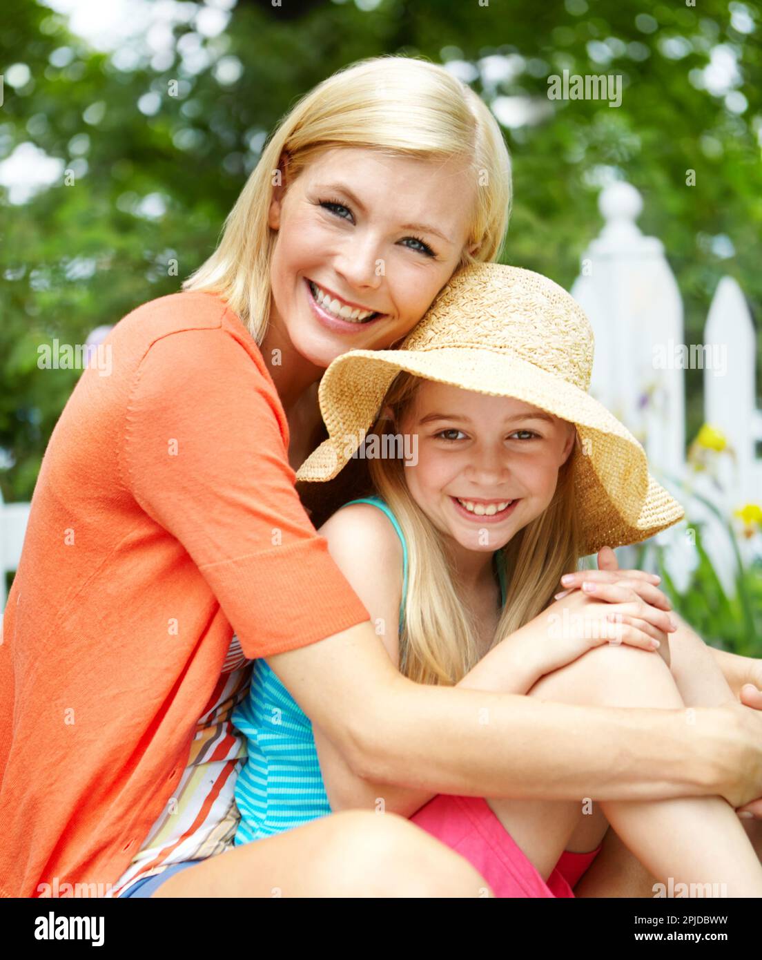 Summertime bonding. Cute litte girl sitting on the grass outdoors with her mom Stock Photo - Alamy