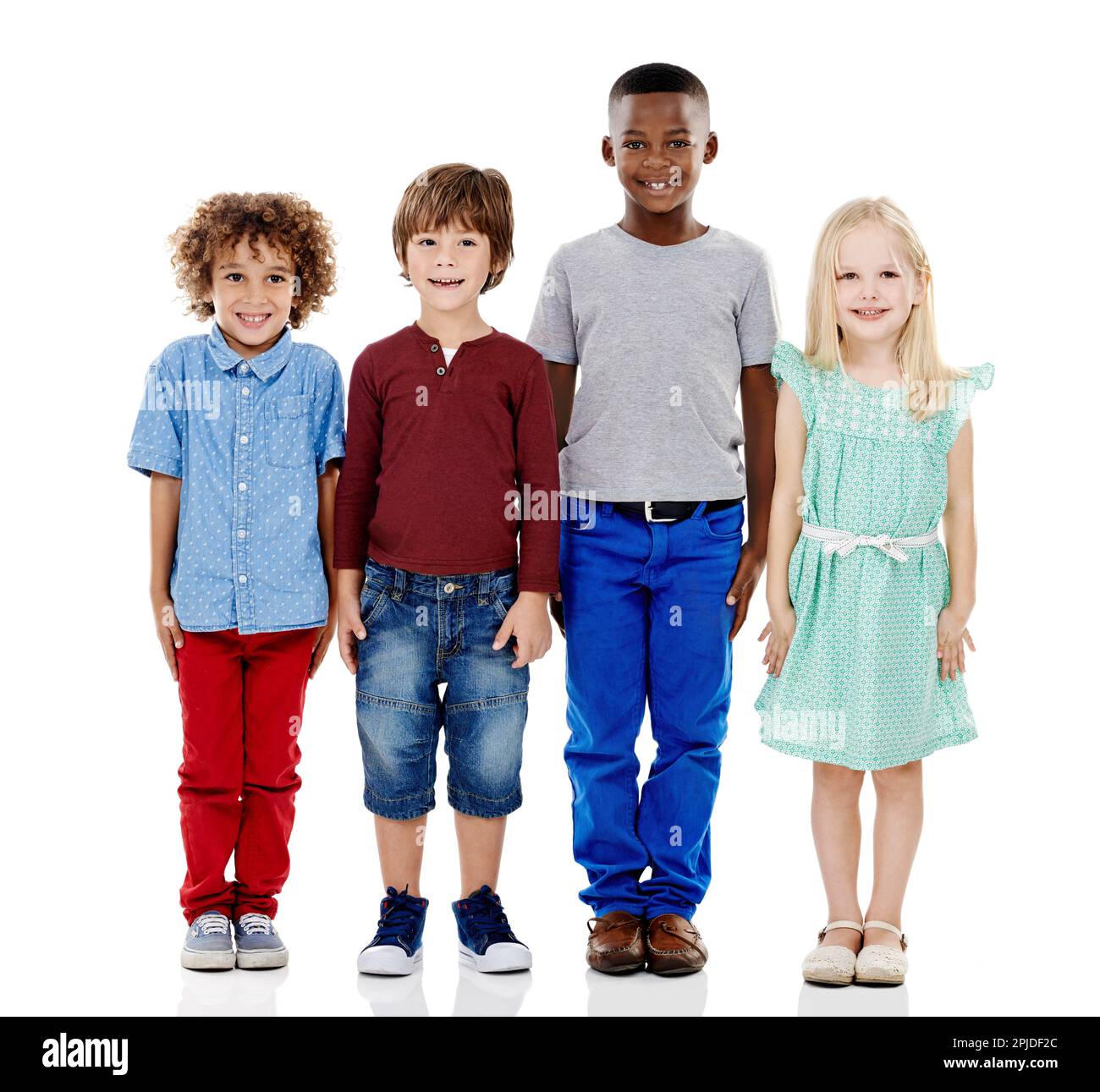 Lined up for fun. Studio shot of a group of young friends standing ...