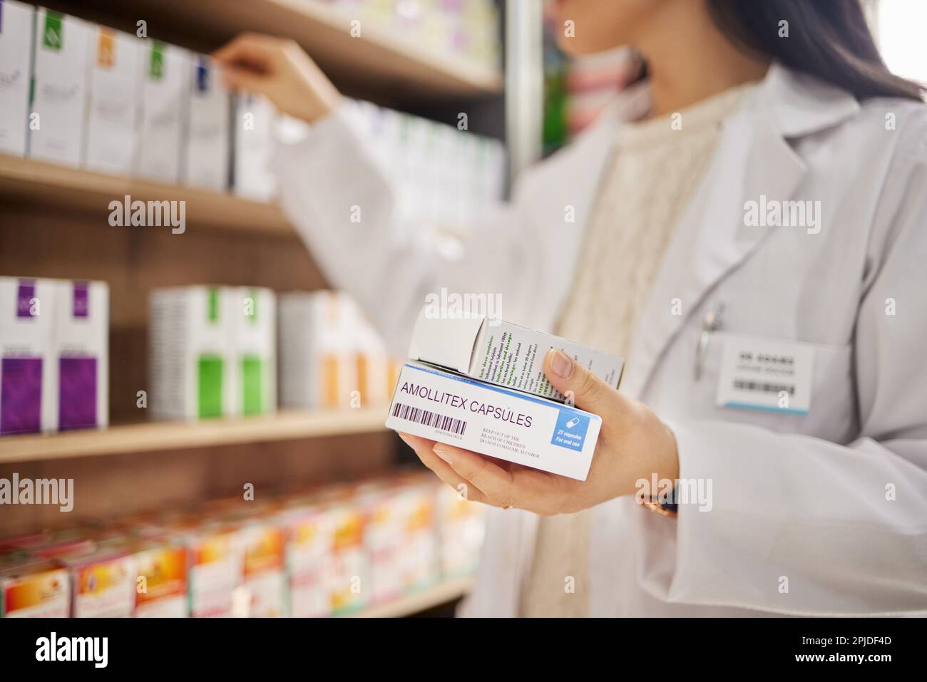 Pharmacy, tablet box in hand and woman pharmacist in drug store, pills ...