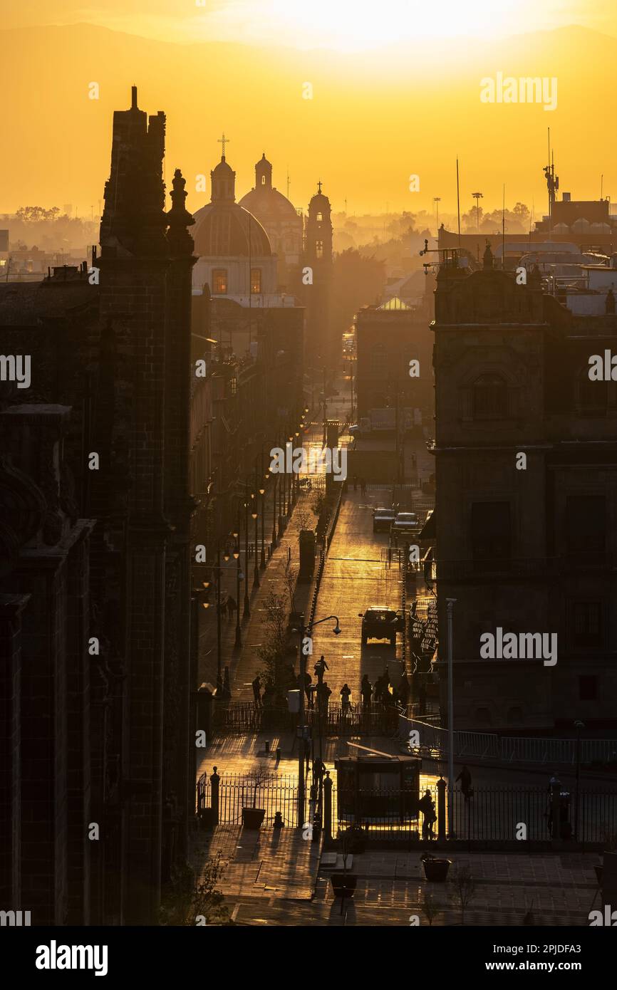 Side street of the Zocalo main square and Metropolitan Cathedral on the ...