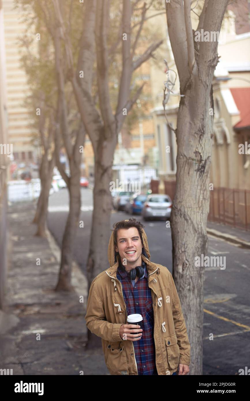Out and about, around downtown. a handsome young man chilling in a ...