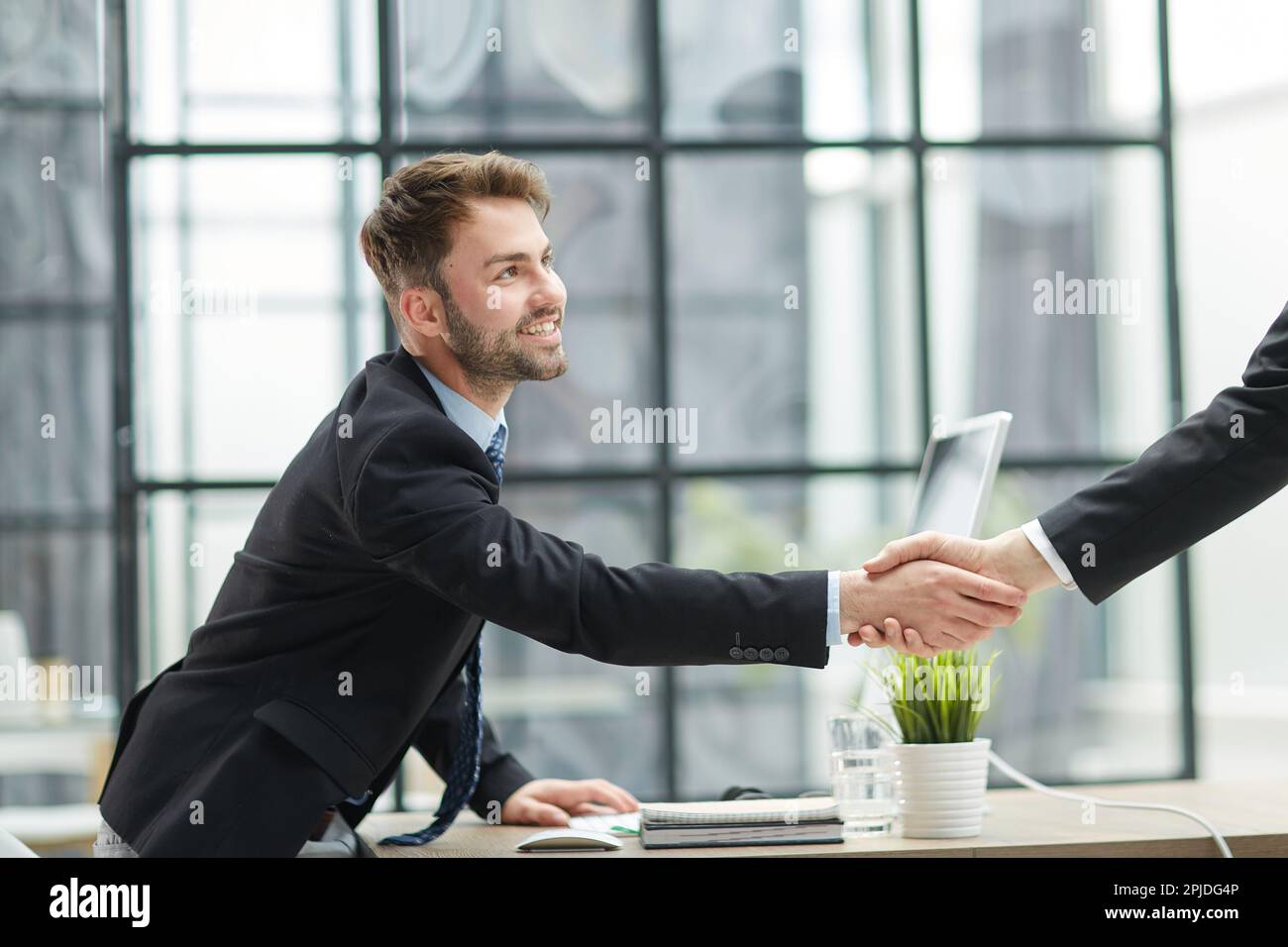 Hello by Man in Office, Indoor Waving Hand Stock Photo - Alamy