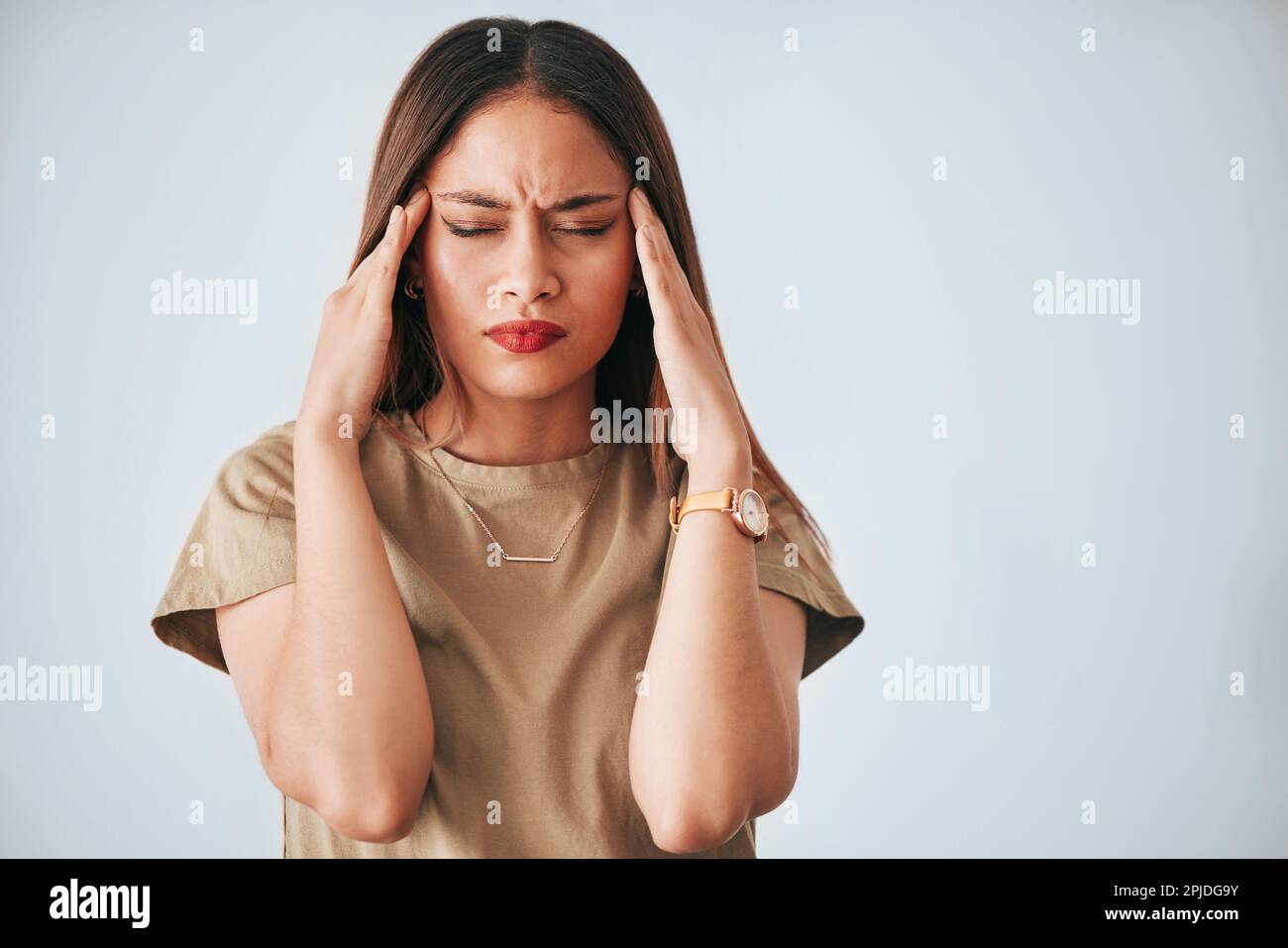 Headache, stress and woman in studio with anxiety, temple massage and ...