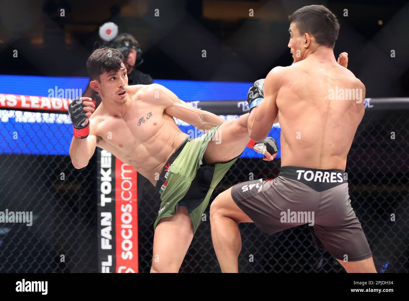 Las Vegas, NV, USA. 1st Apr, 2023. Featherweight (L) Alejandro Flores kicks (R) Daniel Torres ...