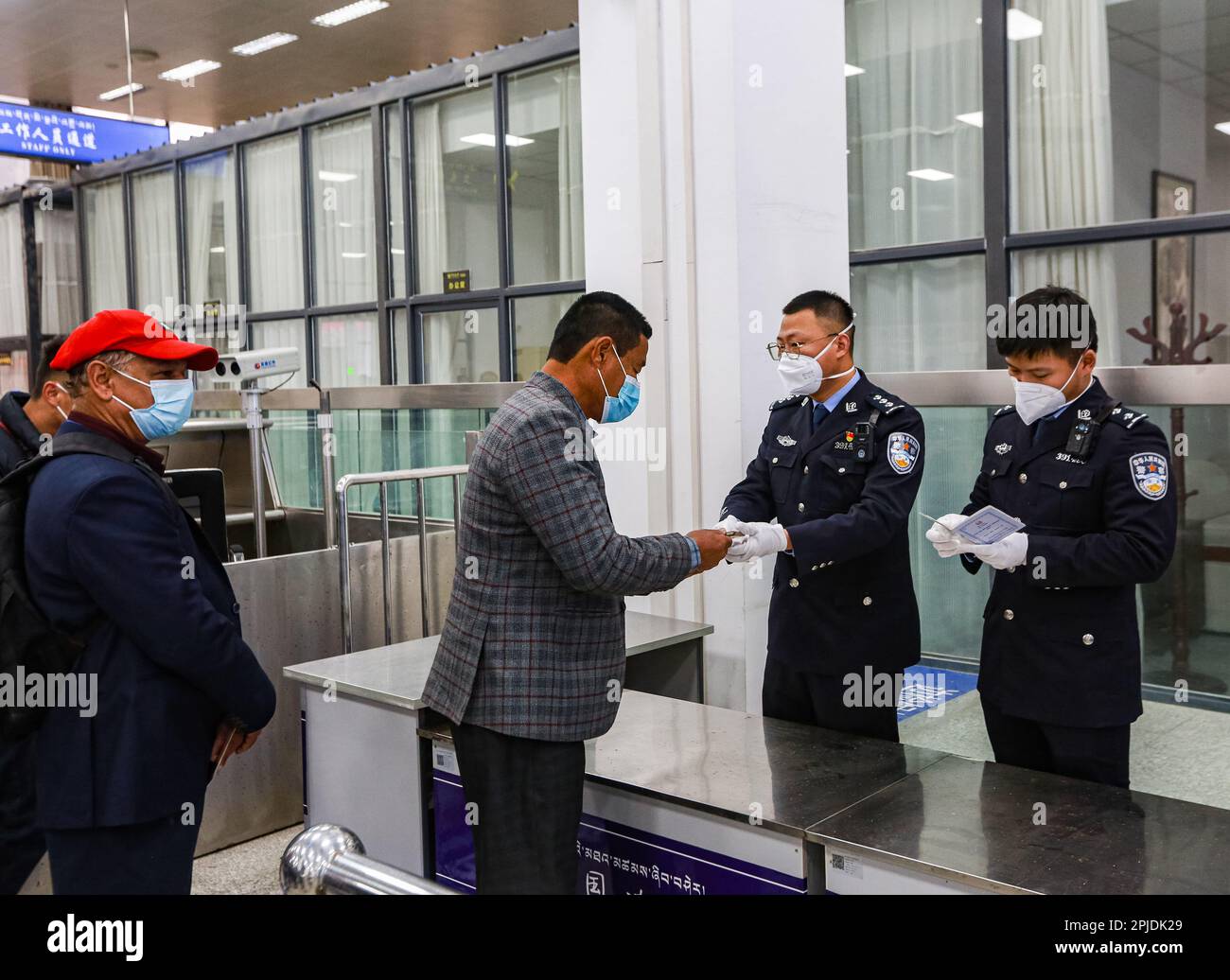 Lhasa. 1st Apr, 2023. Passengers have their credentials checked at the ...