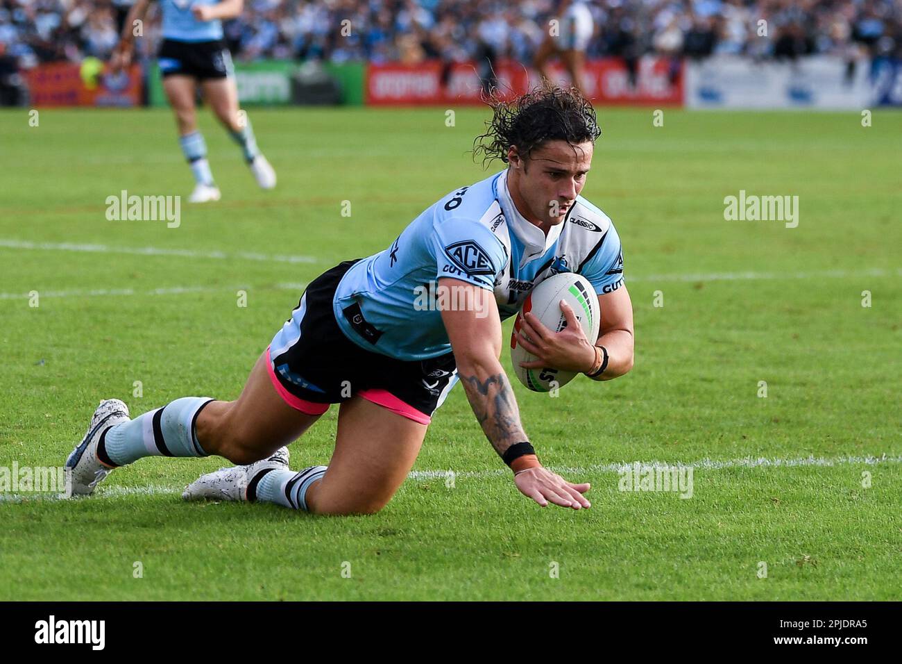 Nicho Hynes of the Cronulla Sharks scores a try that is later called ...