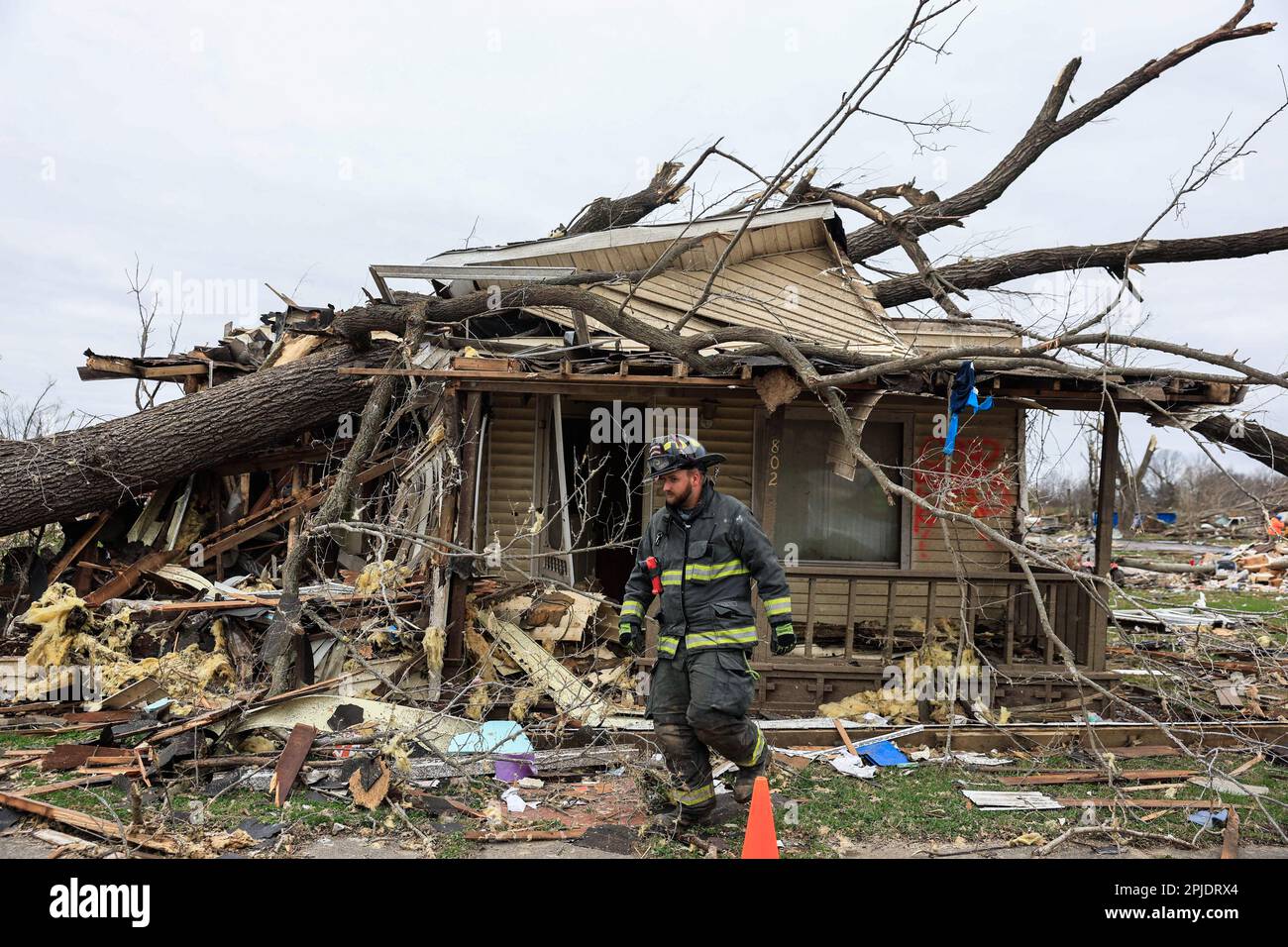 Sullivan, USA. 01st Apr, 2023. A firefighter helps with search and ...
