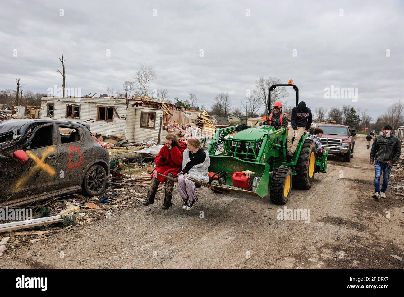 Sullivan, USA. 01st Apr, 2023. Residents catch a ride on a tractor ...