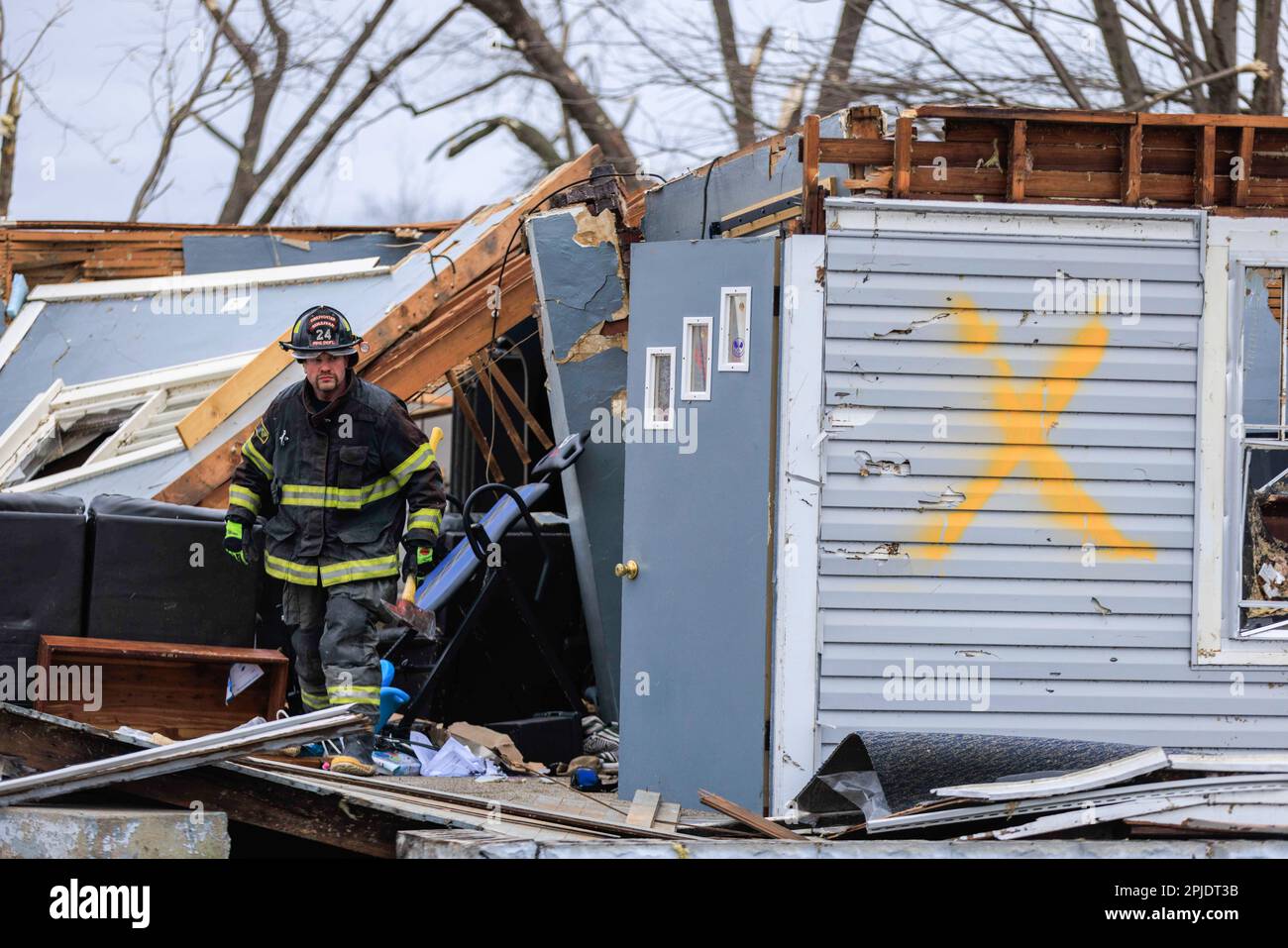 Sullivan, United States. 01st Apr, 2023. A firefighter helps with ...