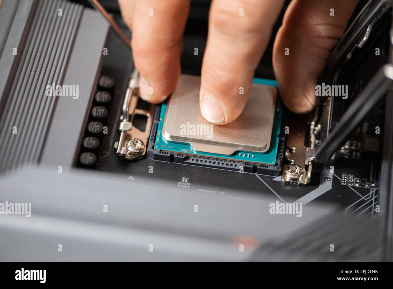 Installing a new intel processor by the computer user Stock Photo - Alamy