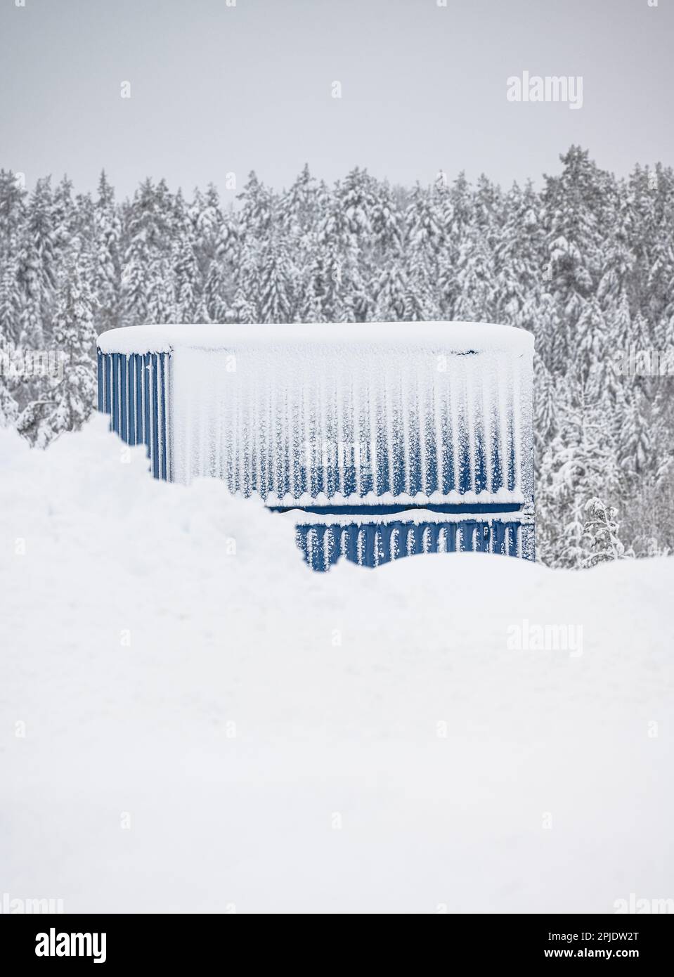 Two blue containers in deep snow Stock Photo - Alamy