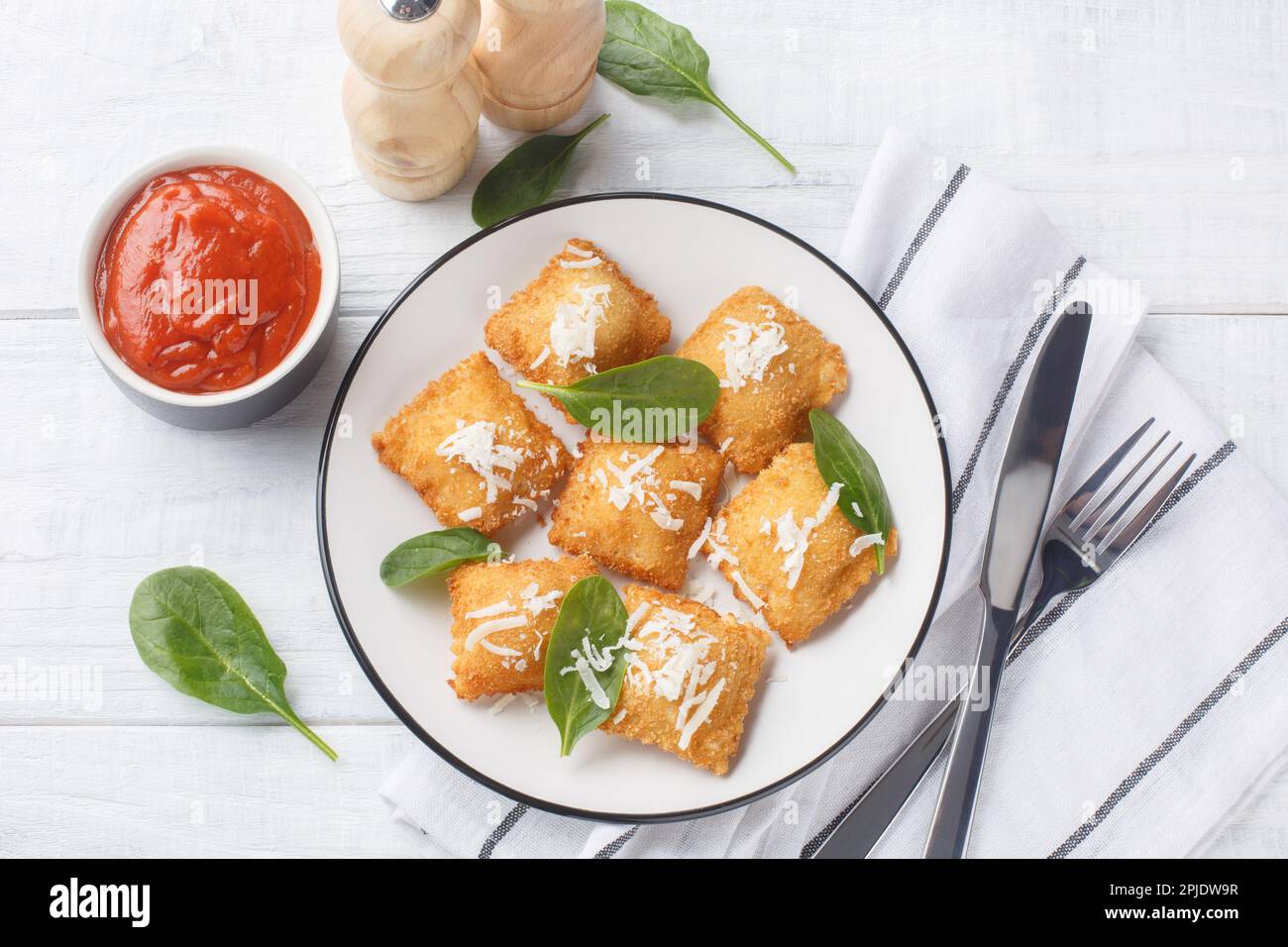 Breaded fried Italian ravioli with hot marinara tomato dipping sauce ...