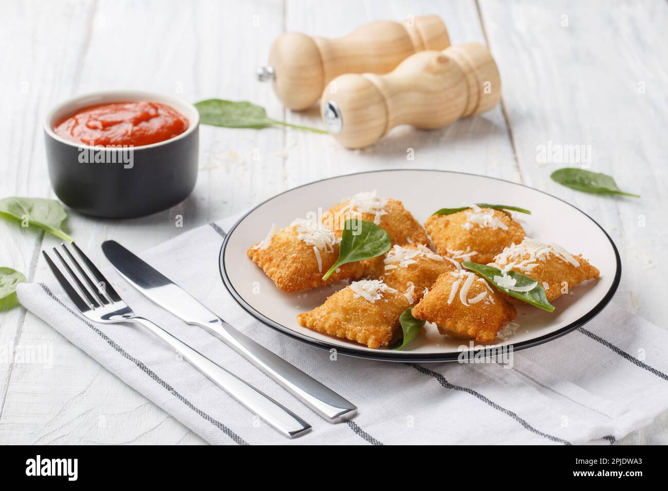 Breaded fried Italian ravioli with hot marinara tomato dipping sauce ...