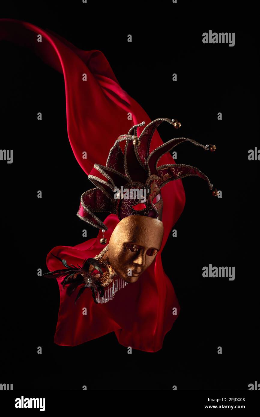 Old carnival masks on a black background with flutters red cloth Stock ...