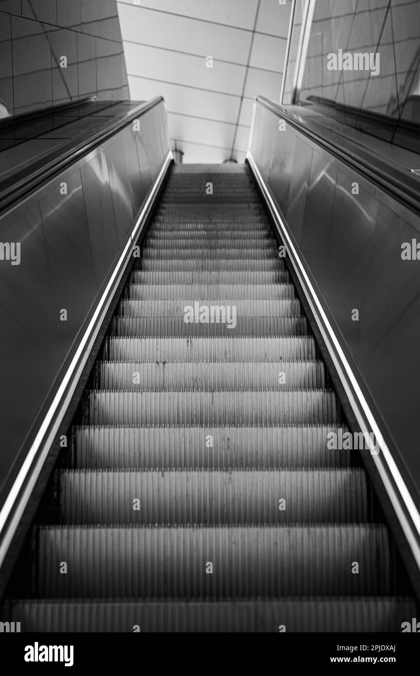 Modern stainless steel escalator Stock Photo - Alamy