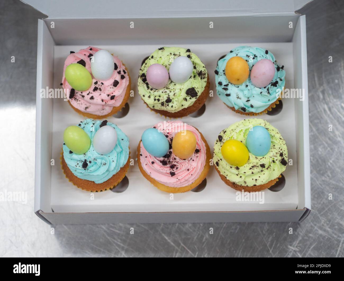 easter pastel handmade group of muffins with confetti chocolate eggs on ...
