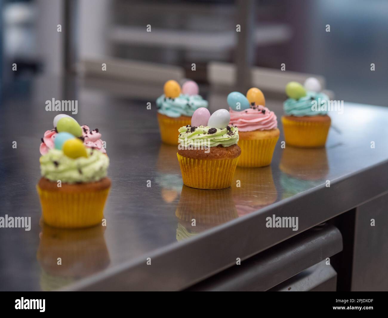 easter pastel handmade group of muffins with confetti chocolate eggs on ...