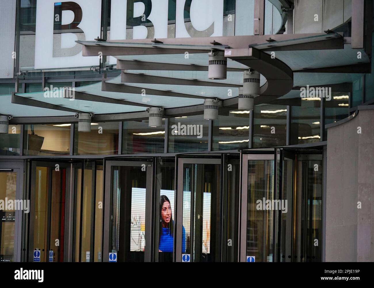 A video screen showing Home Secretary Suella Braverman appearing on the ...