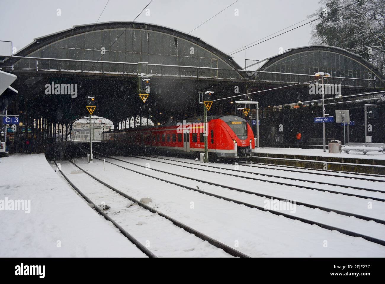 Regional Deutsche Bahn trains at Aachen Railway Station in the snow ...