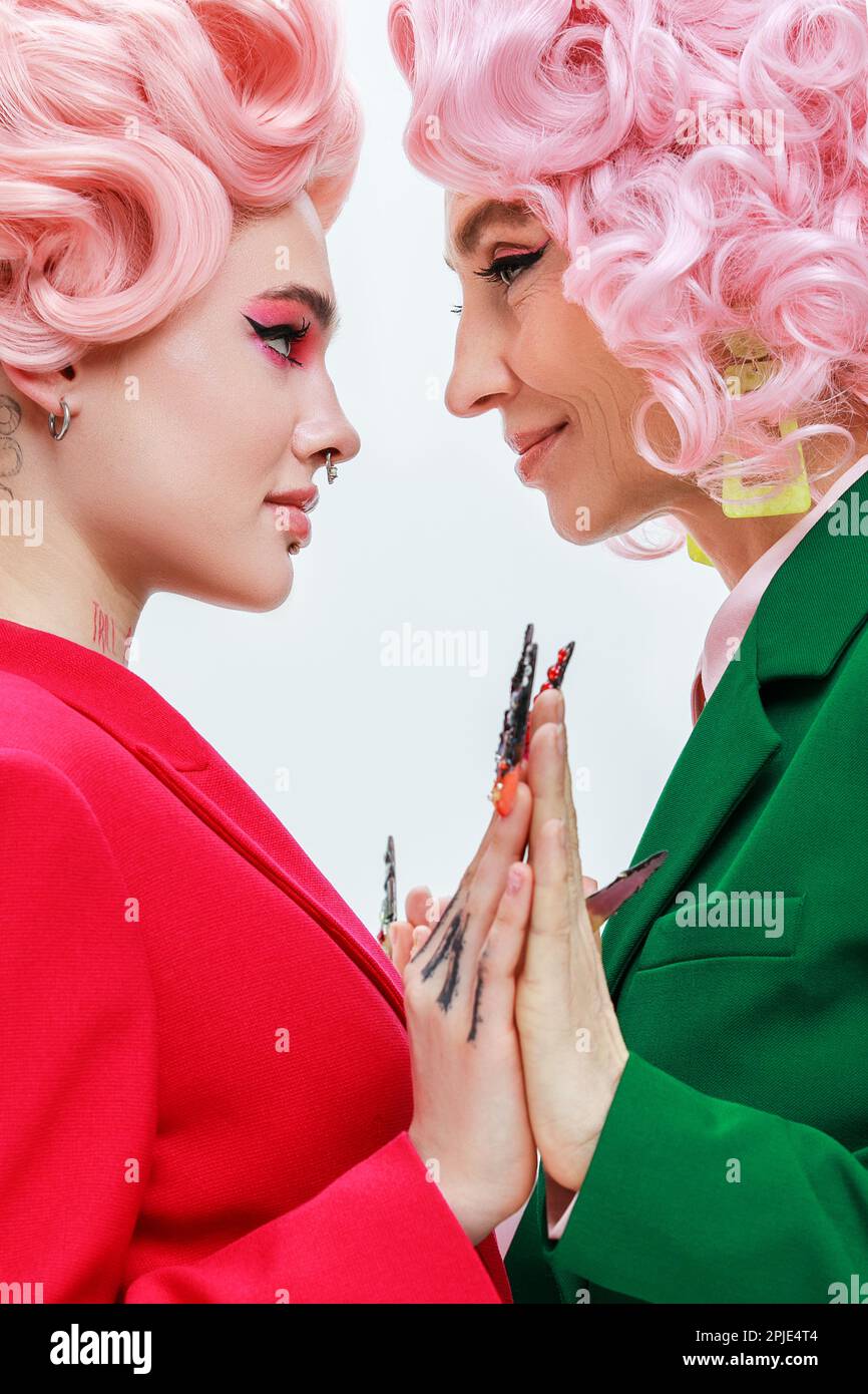 Two models in wigs pose in the studio Stock Photo - Alamy