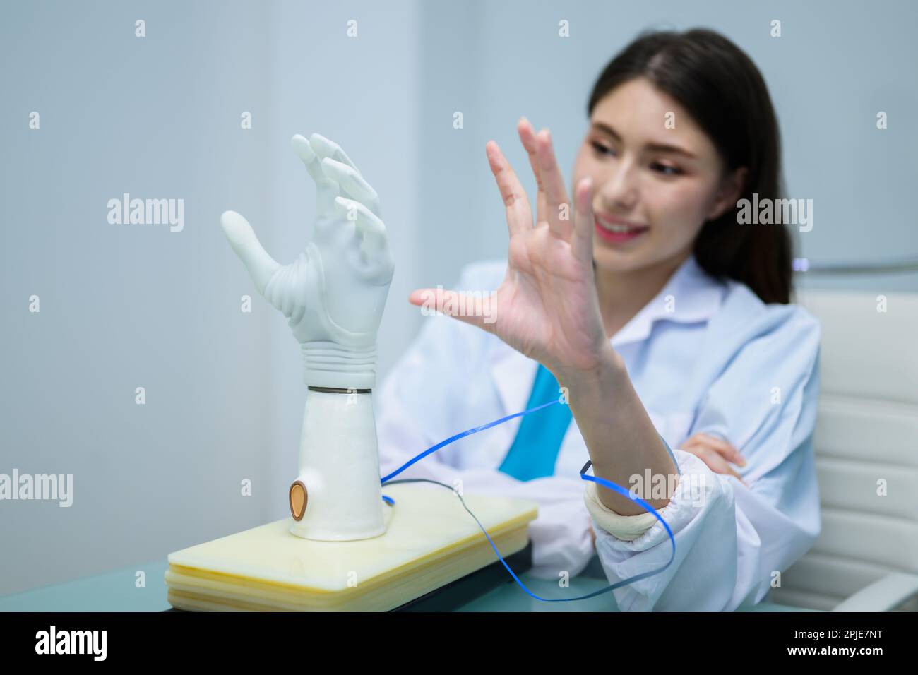 Technician testing robotic bionic arm at prosthetic manufacturing Stock ...