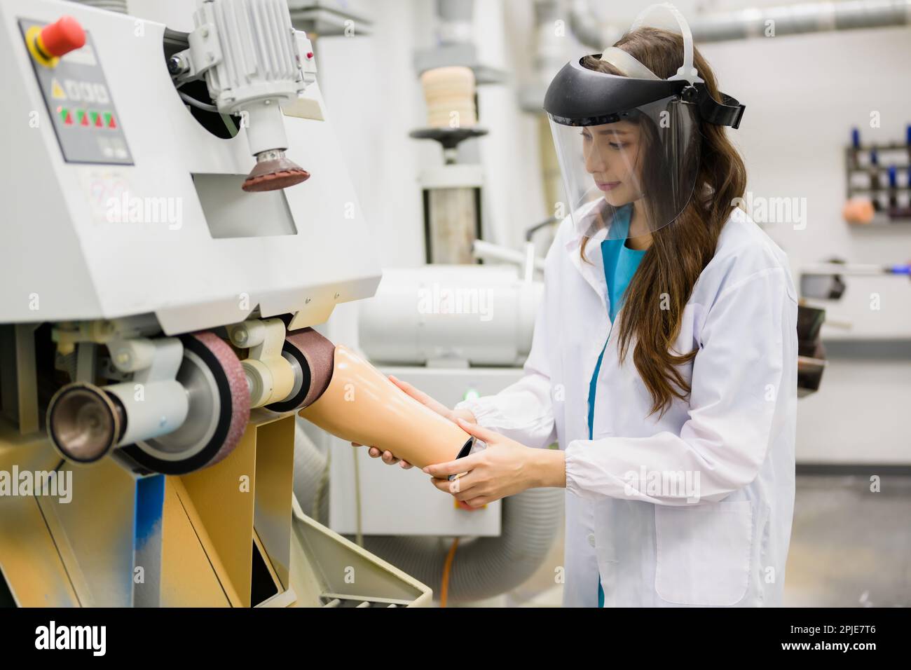 Technician making prosthetic limb using grinder to smooth socket Stock Photo - Alamy