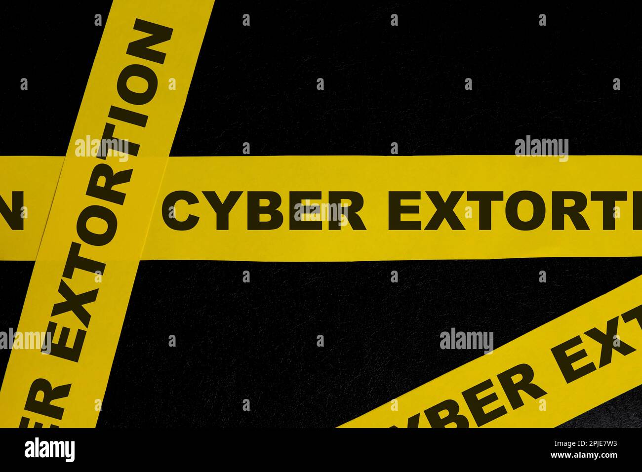 Cyber extortion caution and warning concept. Yellow barricade tape with ...
