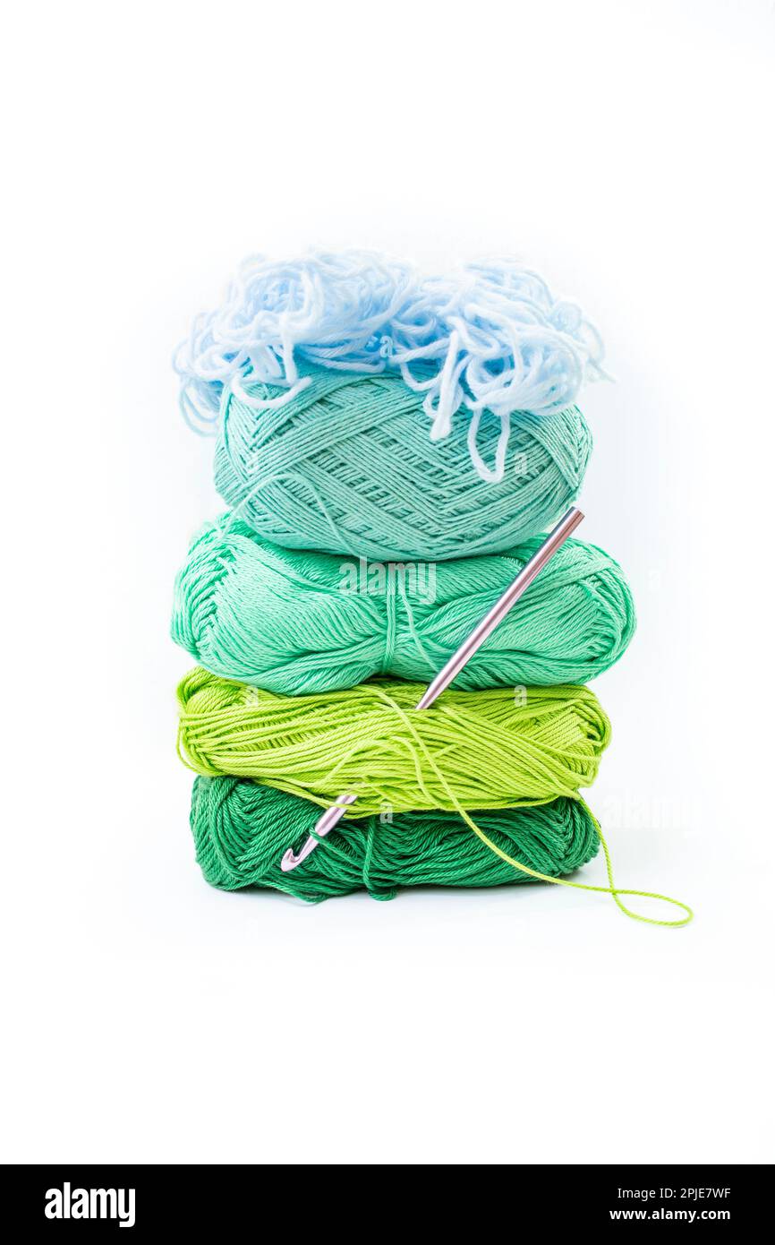 Gradient colored yarn spools stack, cold colors thread coils isolated ...