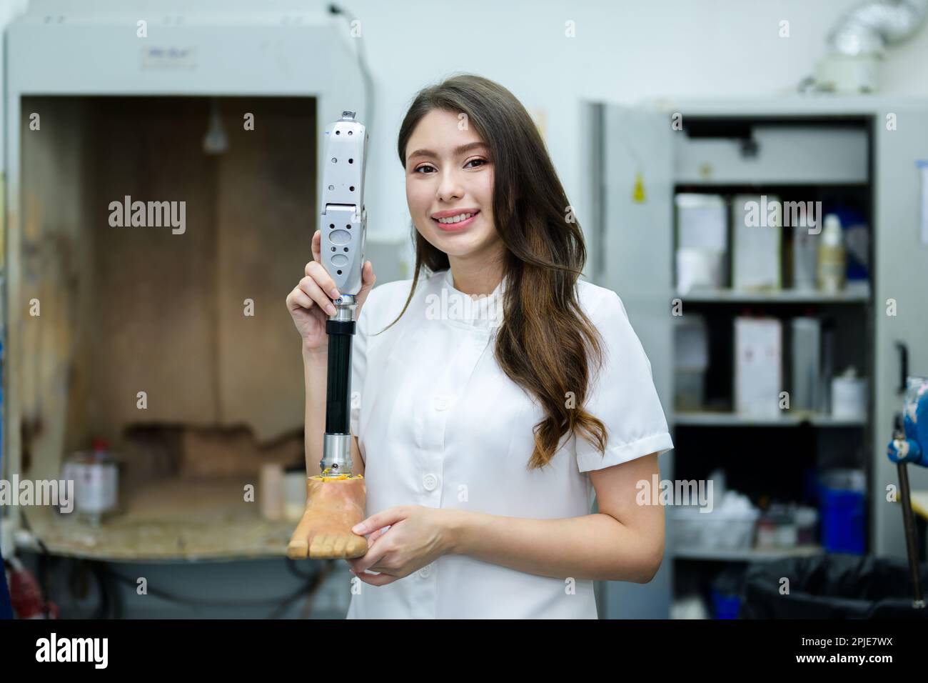 Prosthetic technician holding prosthetic leg checking and controlling Stock Photo - Alamy