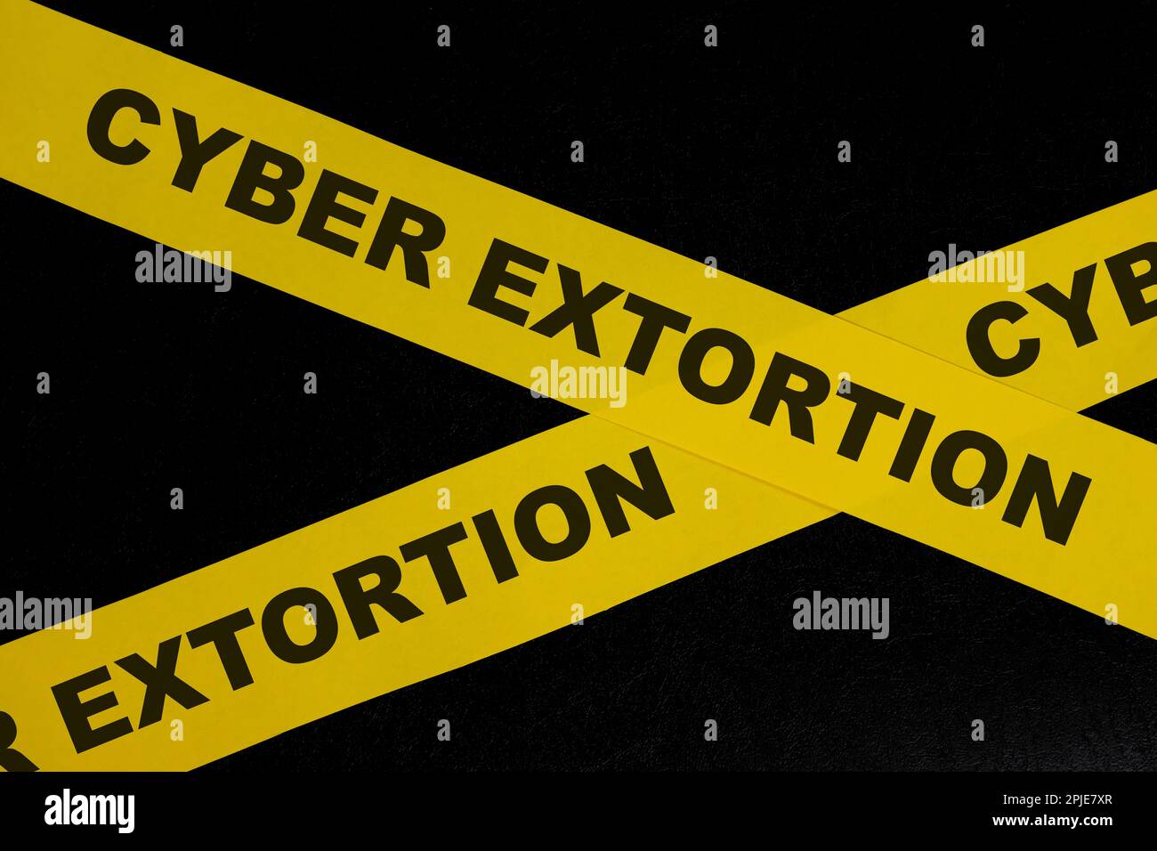 Cyber extortion caution and warning concept. Yellow barricade tape with ...