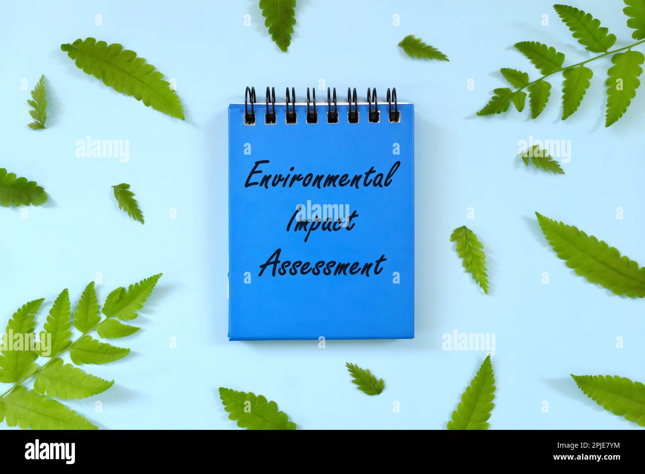 Environmental Impact Assessment or EIA concept. Word written on blue ...