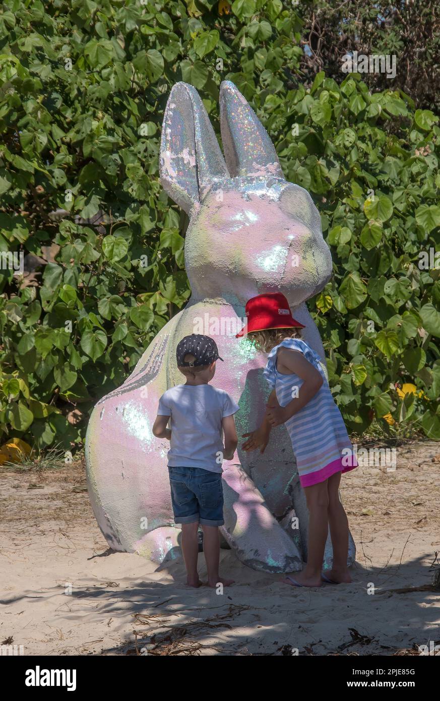 Two small children at Swell Sculpture Festival 2019 examining large ...