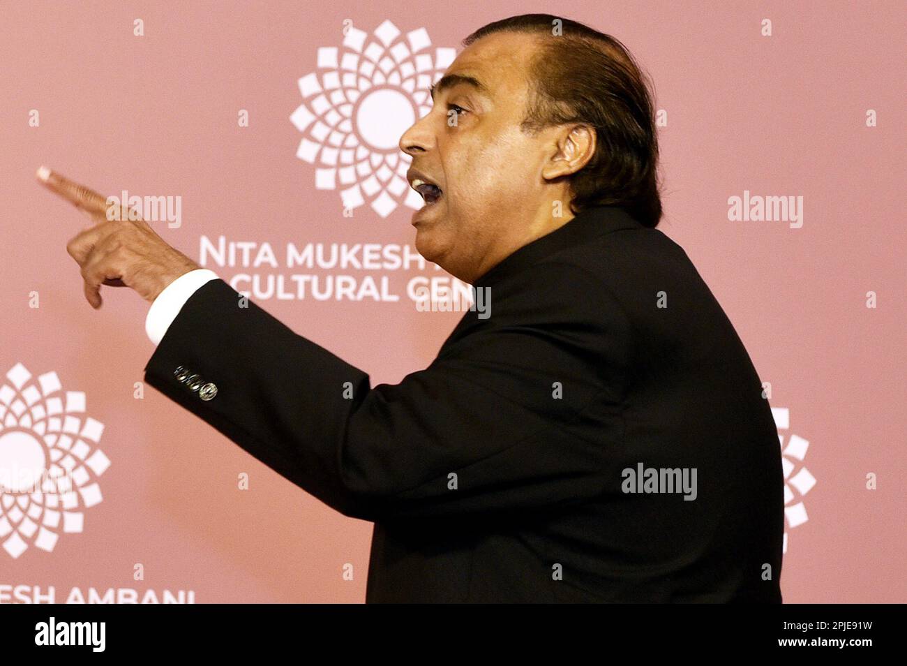 Indian billionaire businessman Mukesh Ambani reacts on the red carpet ...