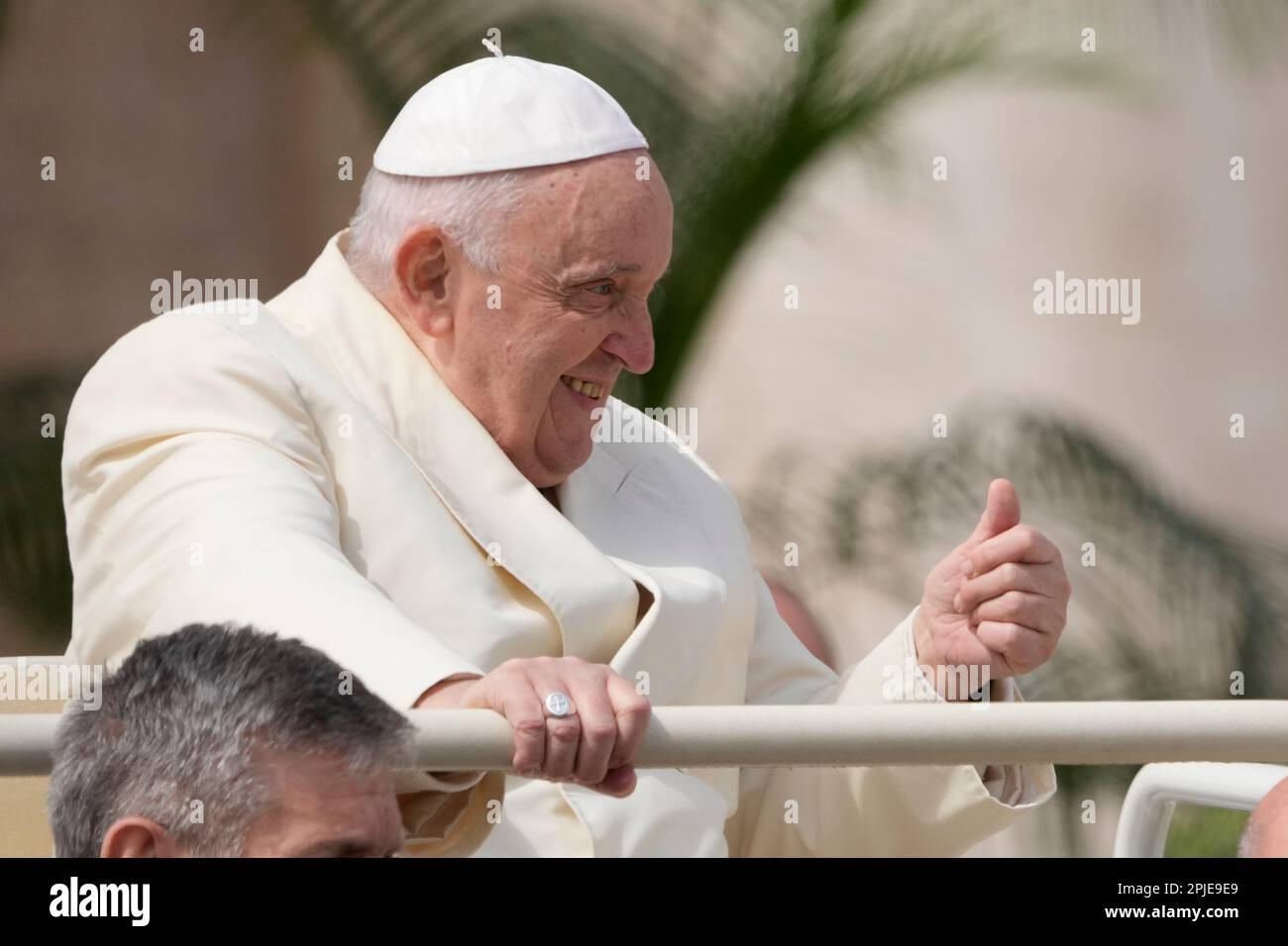 Pope Francis gives thumbs up as he leaves after celebrating the Palm ...