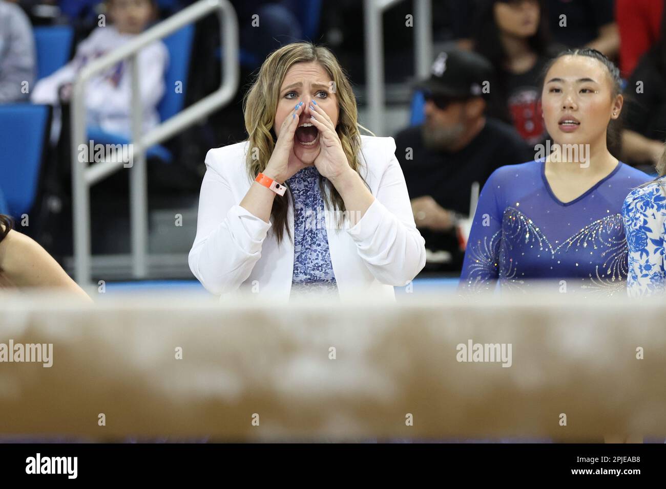 April 1, 2023: Coach Janelle McDonald (UCLA) celebrates a beam routine ...