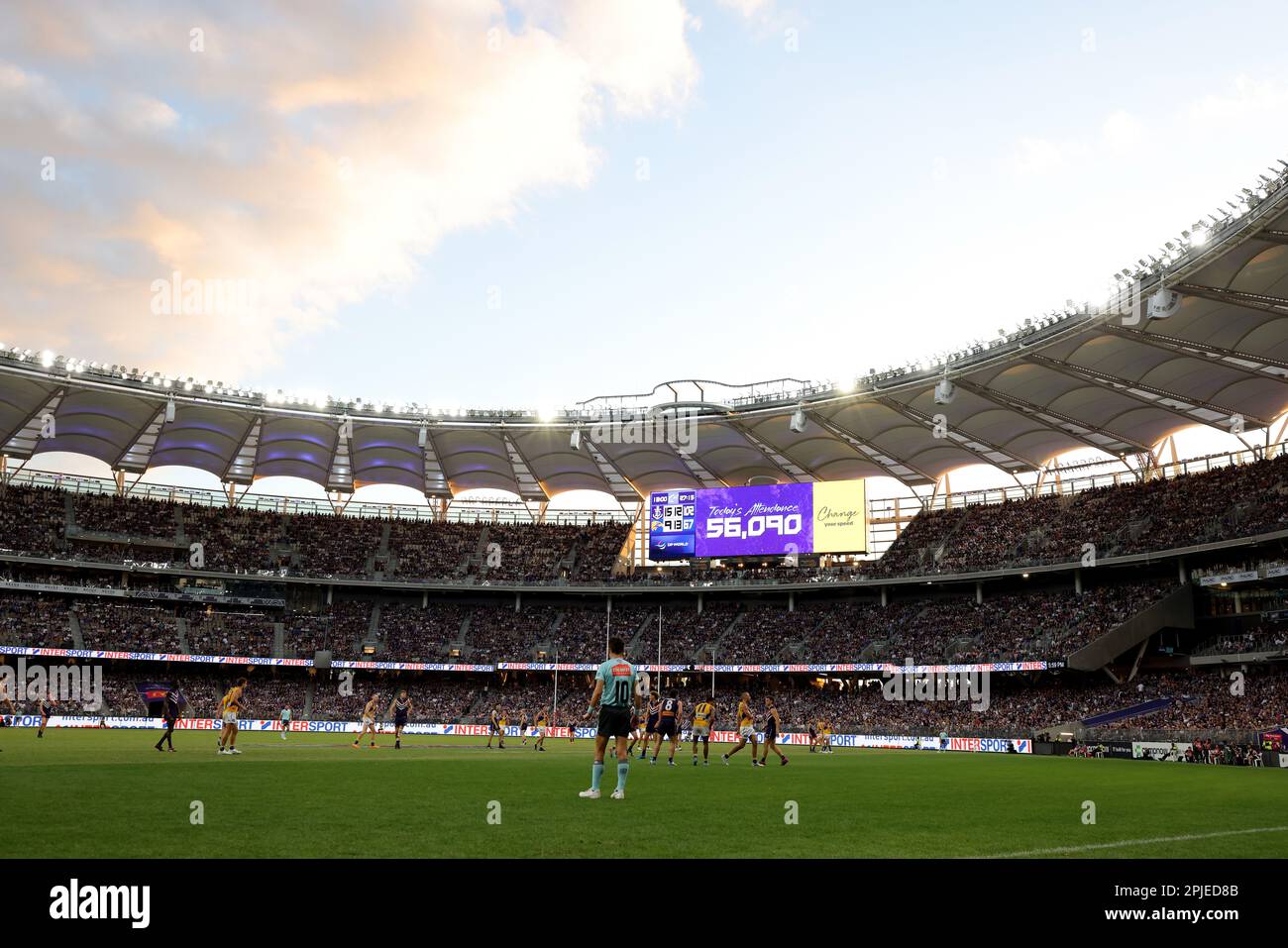 A crowd attendance of 56,090 is displayed during the AFL Round 3 match ...