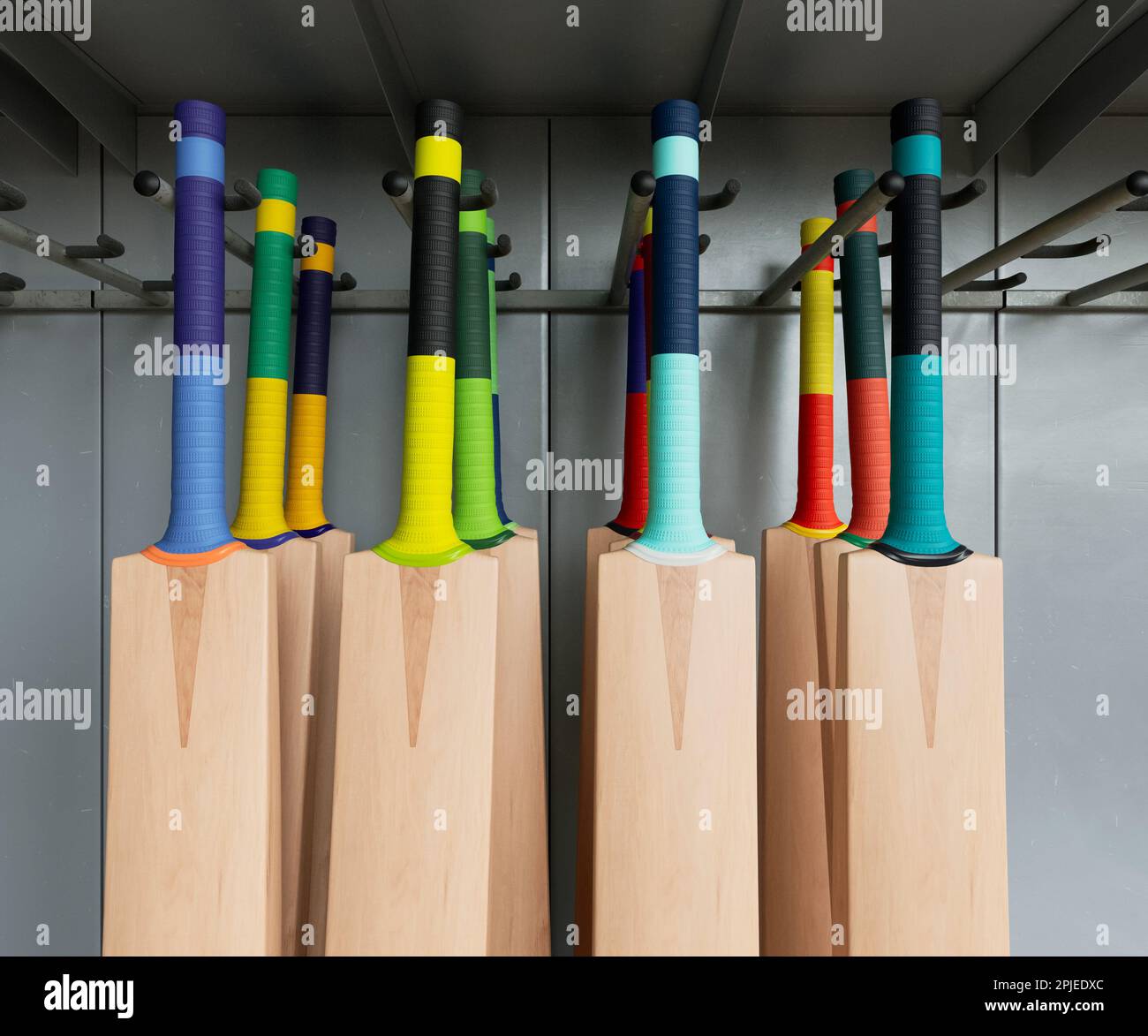 A collection of generic cricket bats with various colorful grips on ...