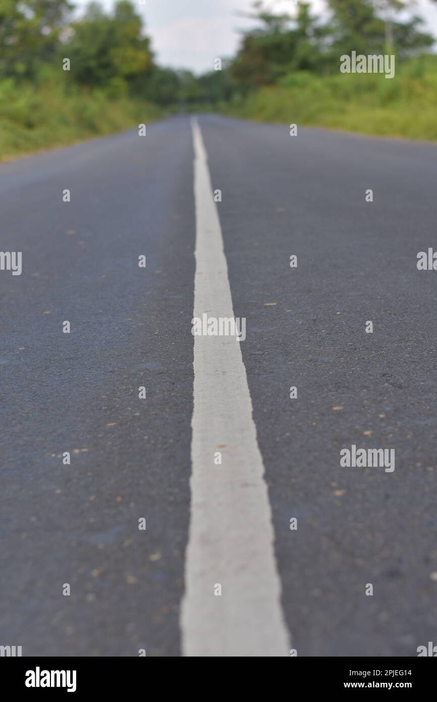Road with white line in middle with no vehicle Stock Photo - Alamy