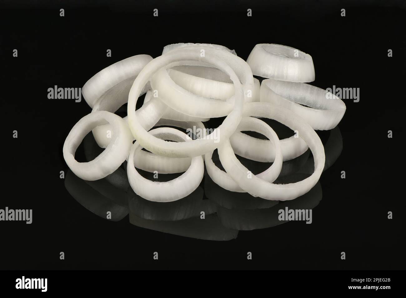 Sliced white onion rings isolated on acrylic black background. High ...