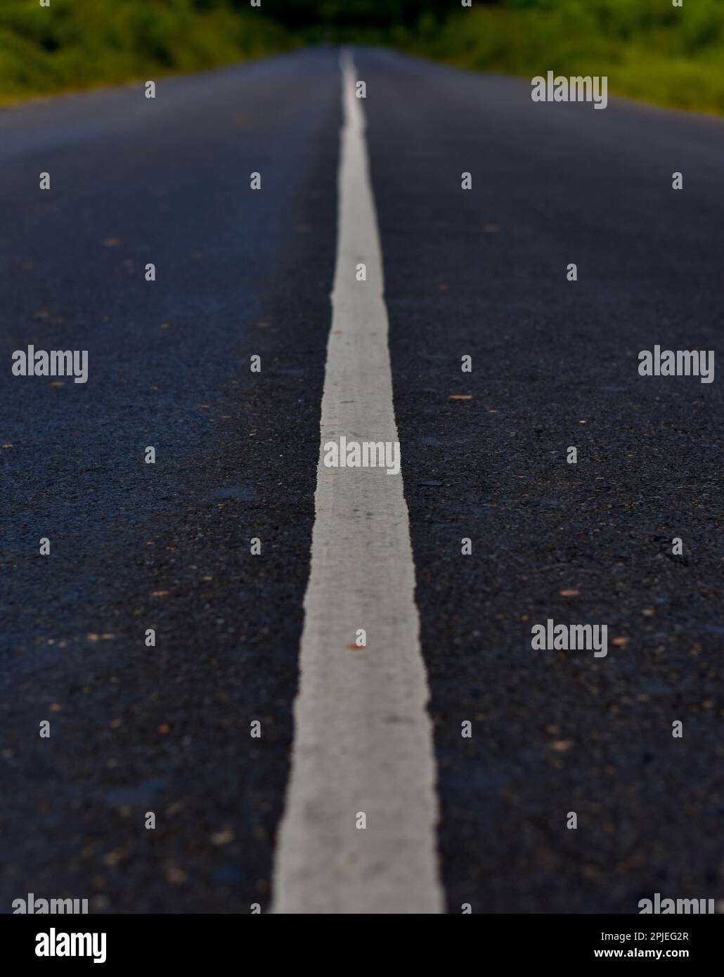 Road with white line in middle with no vehicle Stock Photo - Alamy