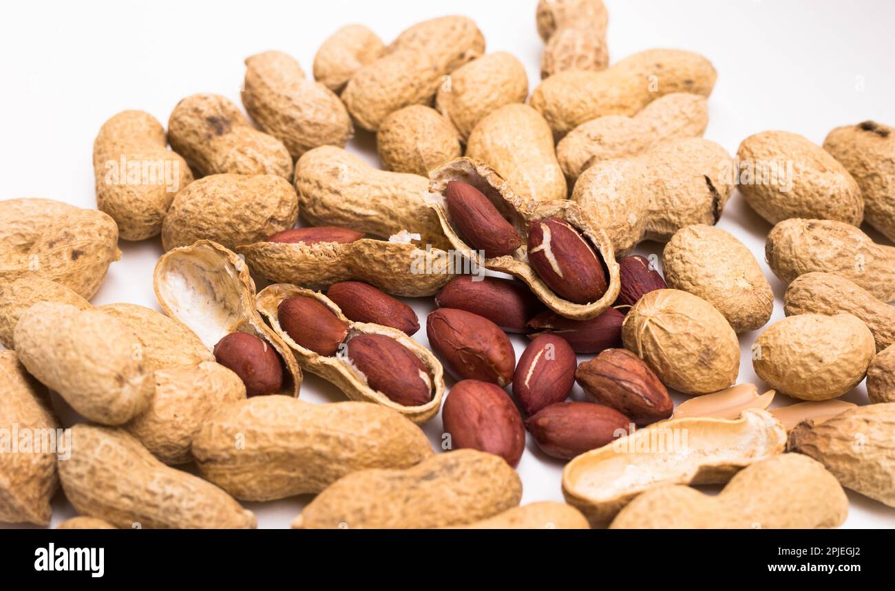 peanut kernels on a white background Stock Photo - Alamy