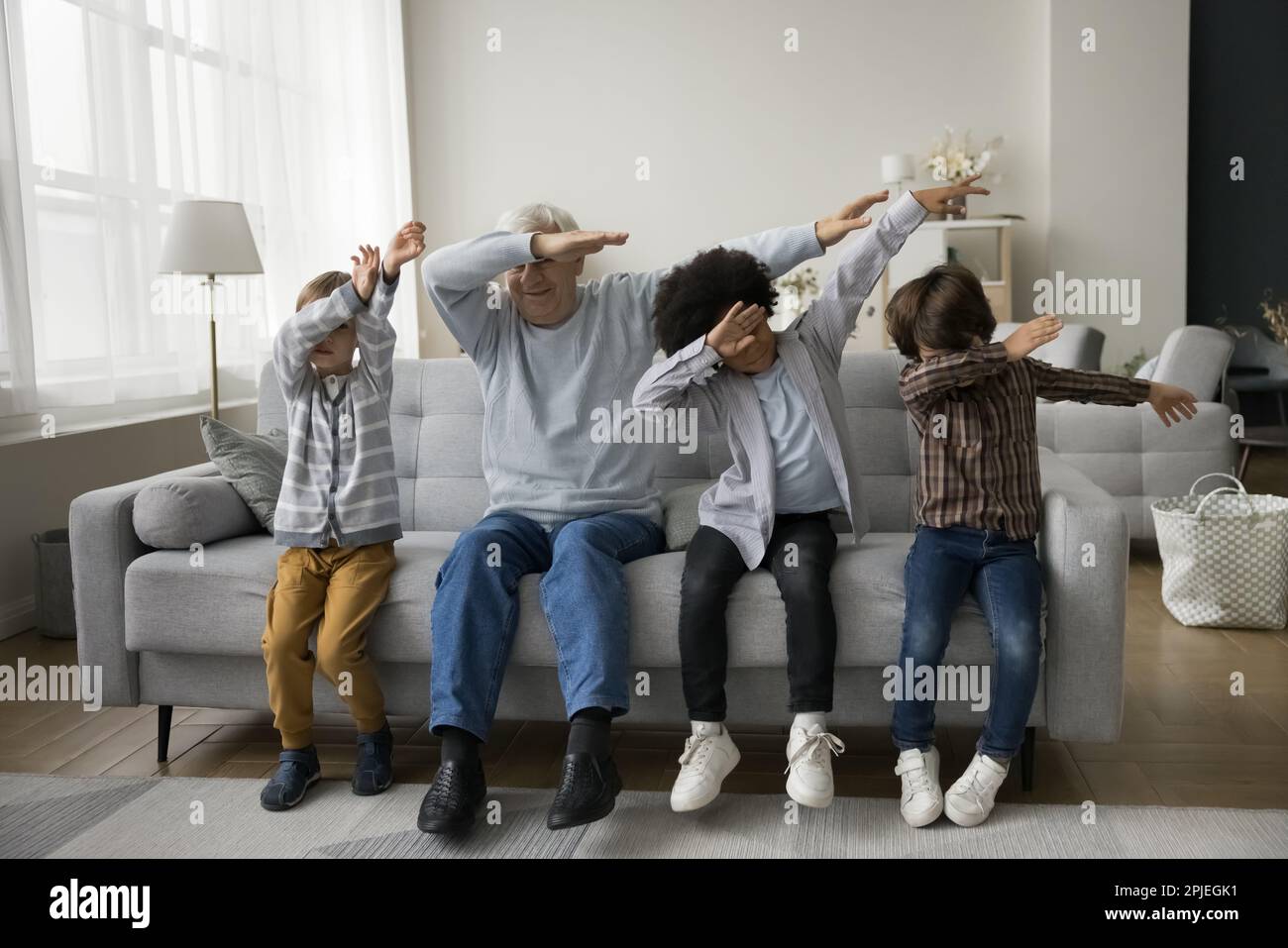 Active grandson kids and old grandfather making dab dance gesture Stock ...