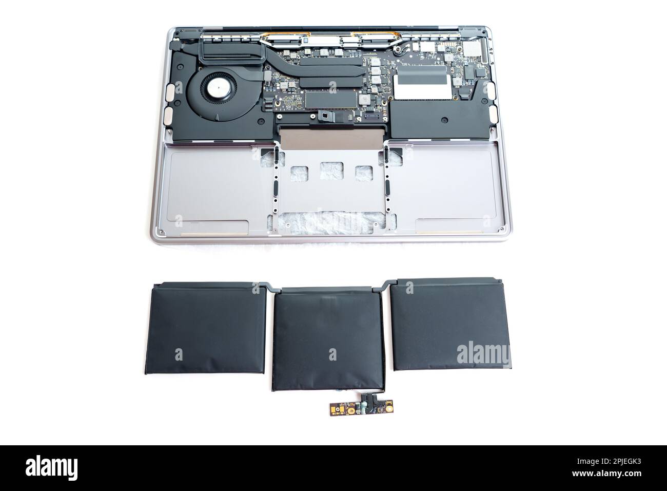 Battery, which has expanded due to internal issues, is placed next to a ...