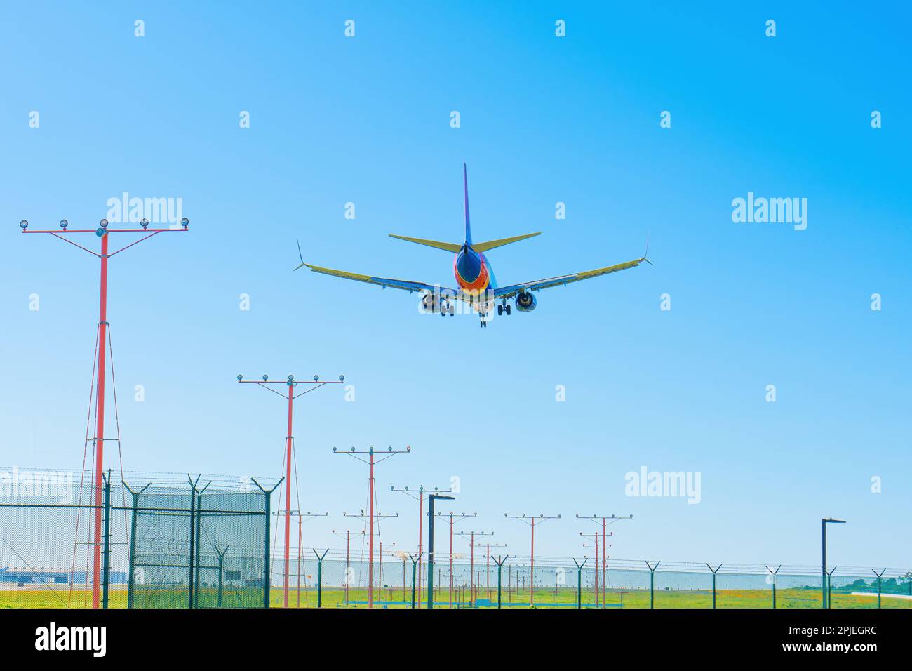 Passenger plane gracefully landing on the runway, as viewed from the ...