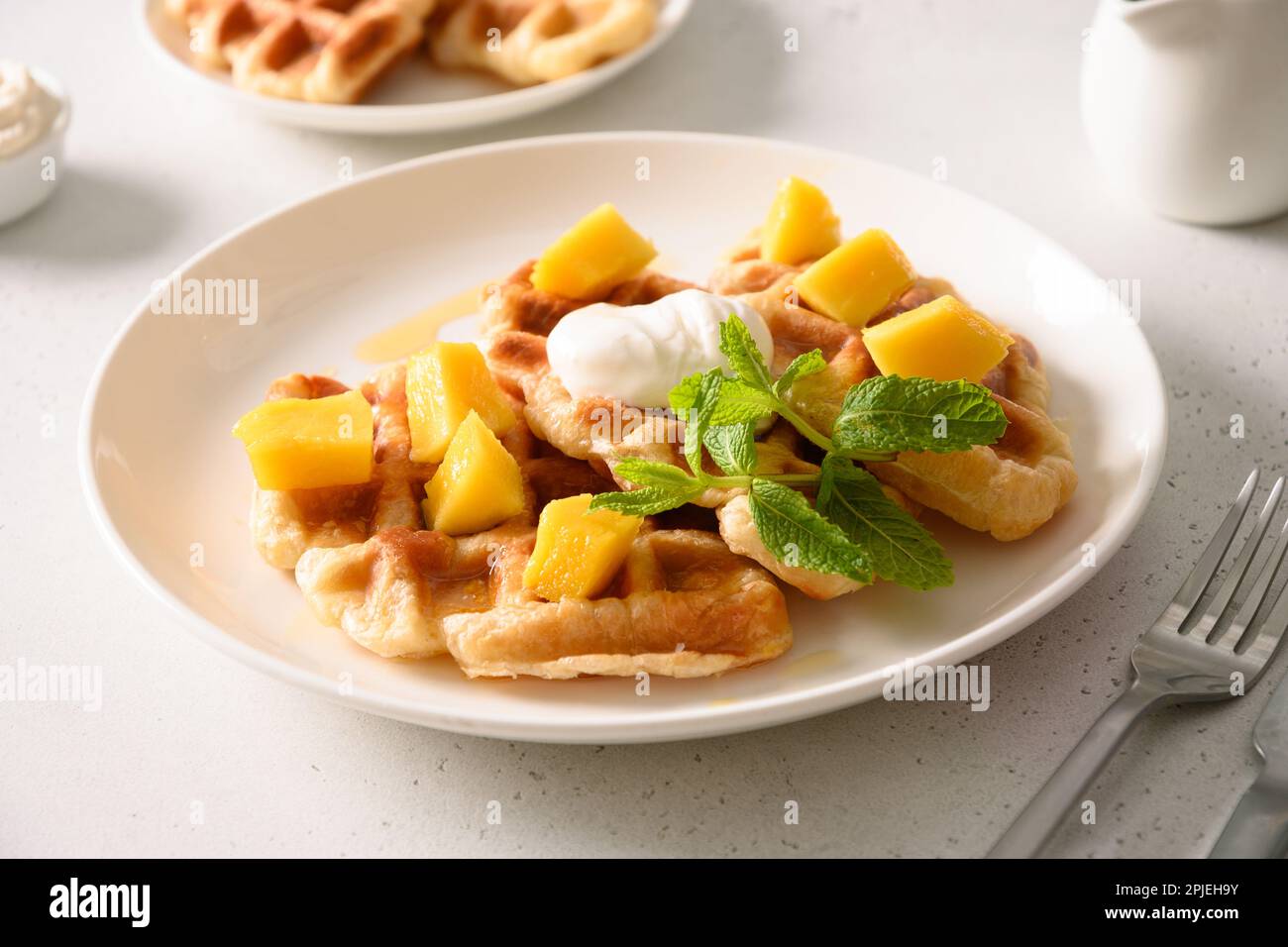 Popular croffles with maple syrup and whipped cream for delicious ...