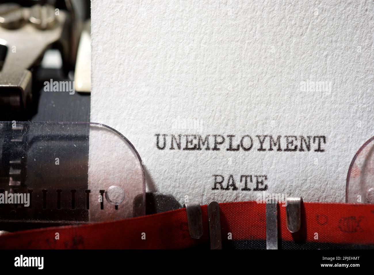 Unemployment rate text written with a typewriter Stock Photo - Alamy