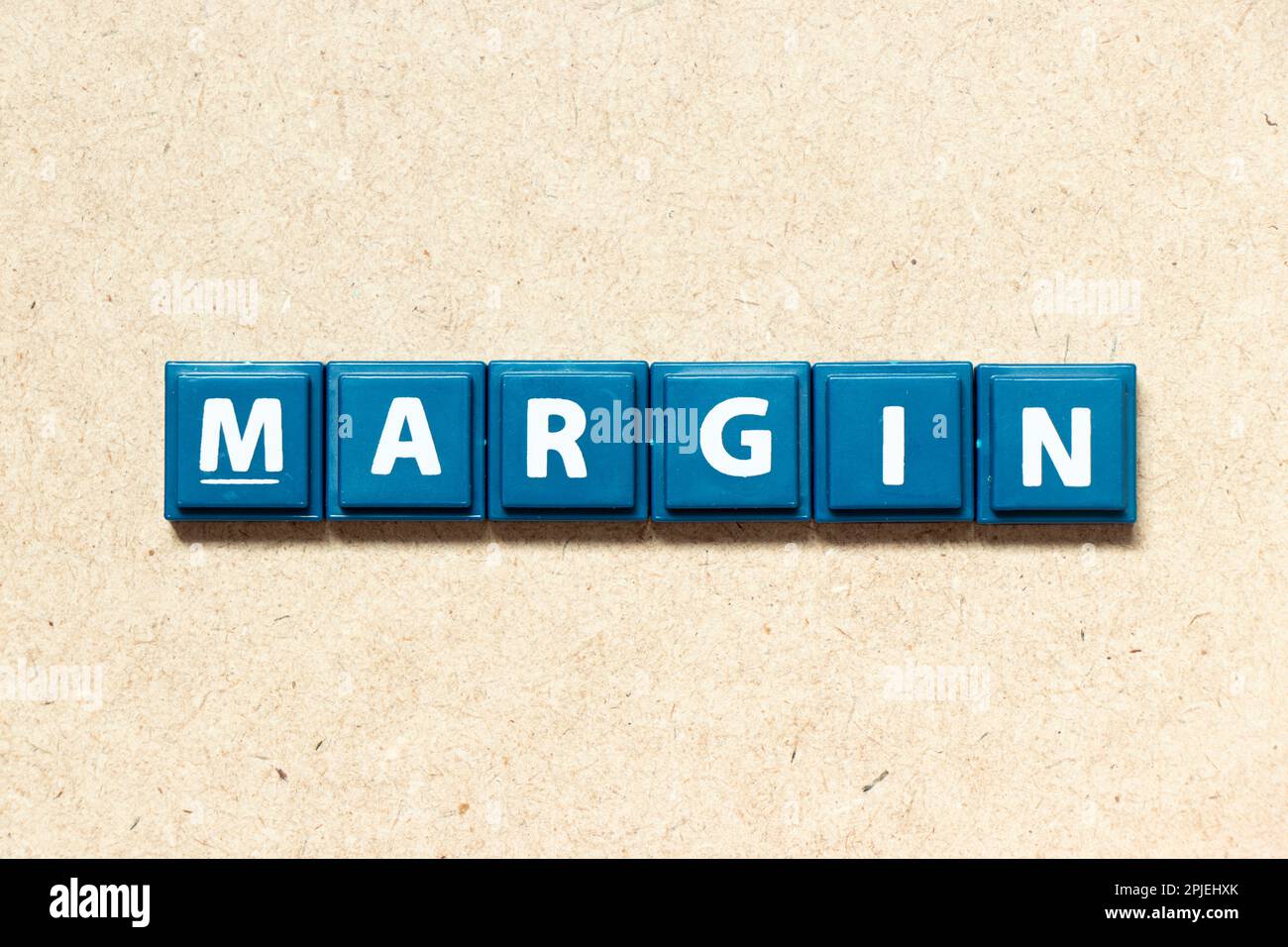 Tile alphabet letter in word margin on wood background Stock Photo - Alamy