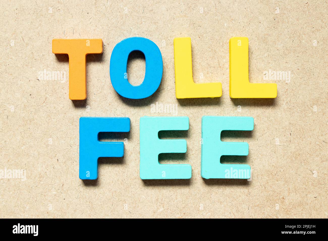 Color alphabet letter in word toll fee on wood background Stock Photo ...