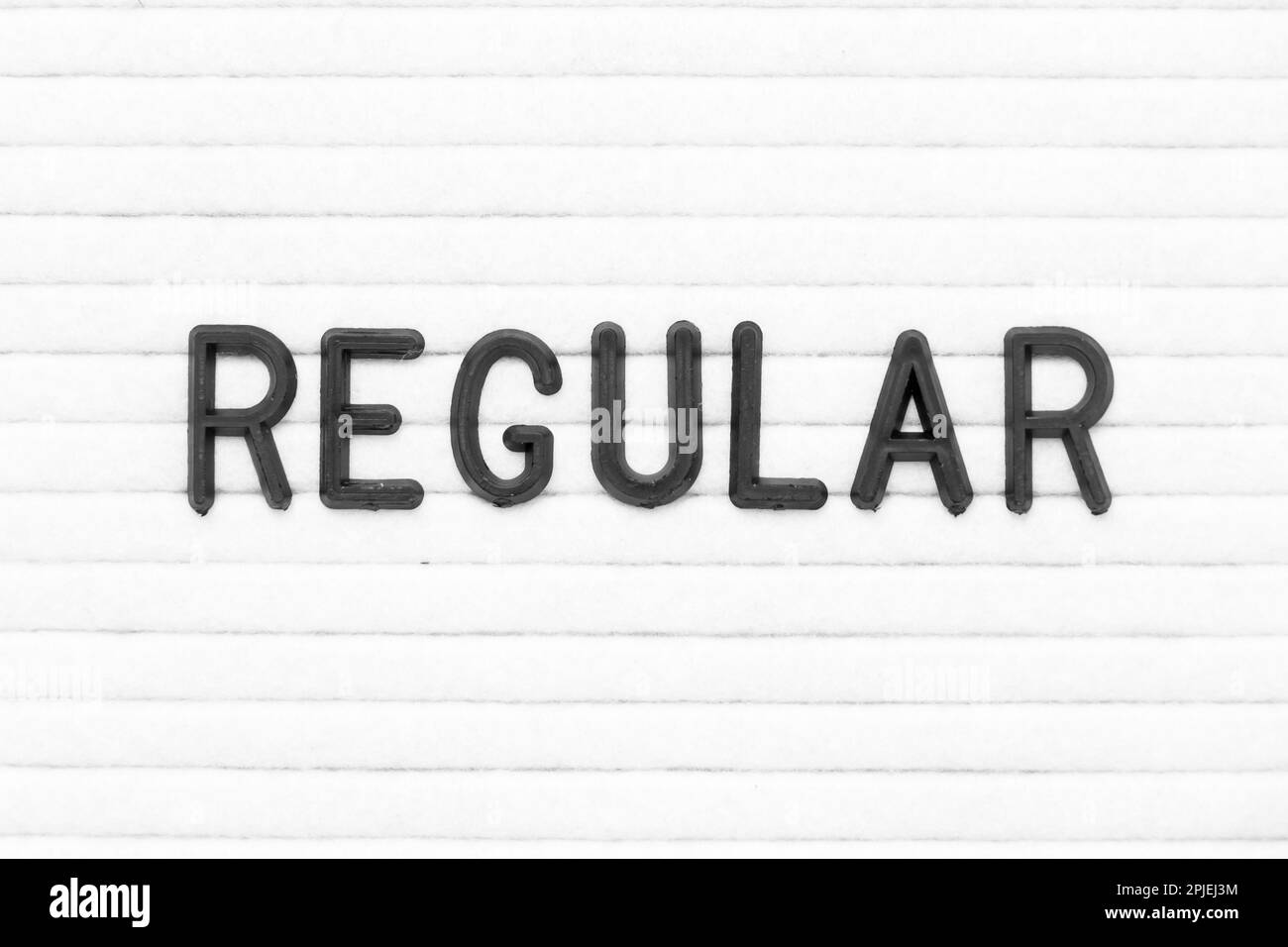 Black color letter in word regular on white felt board background Stock ...