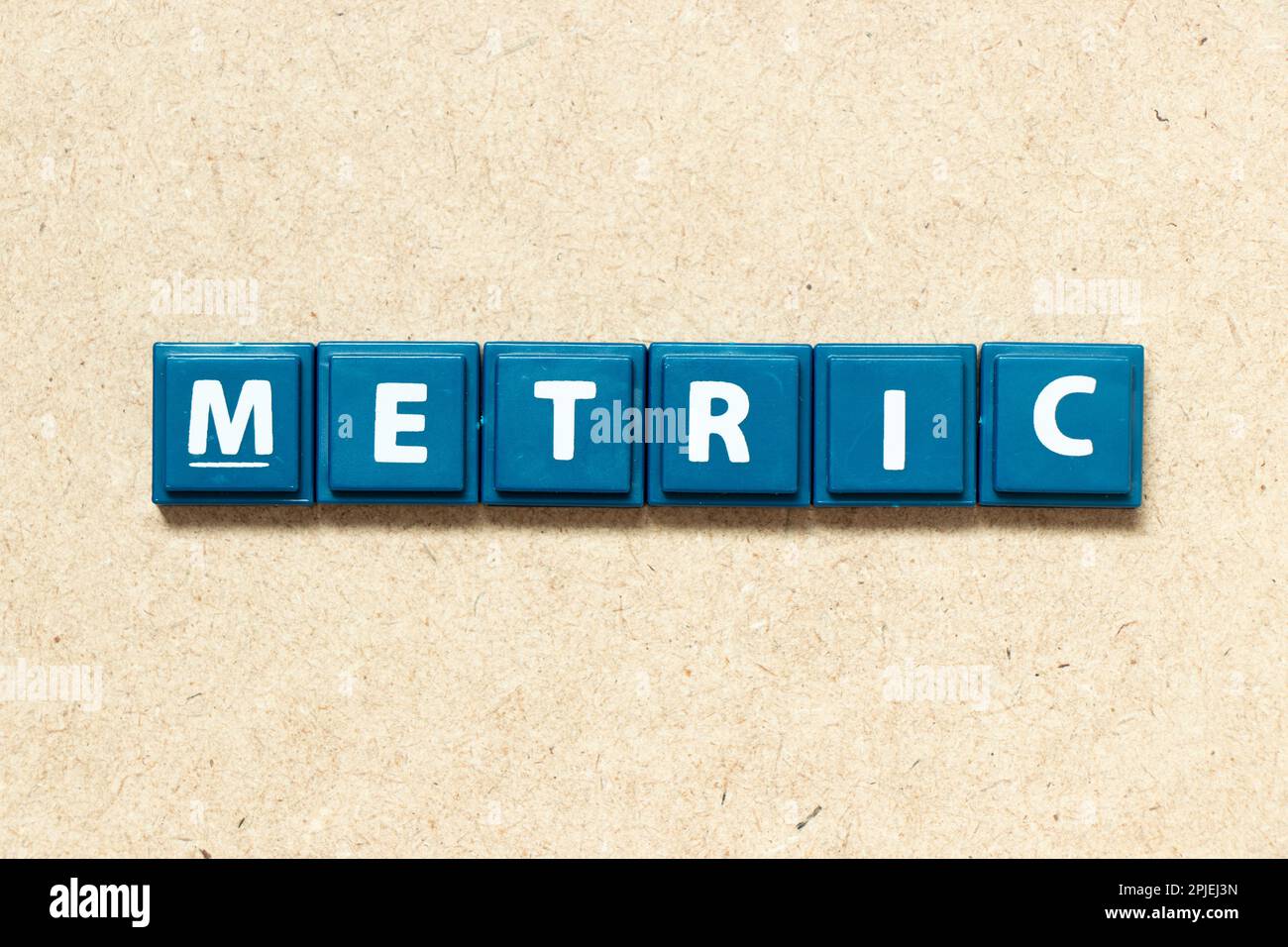 Tile alphabet letter in word metric on wood background Stock Photo - Alamy